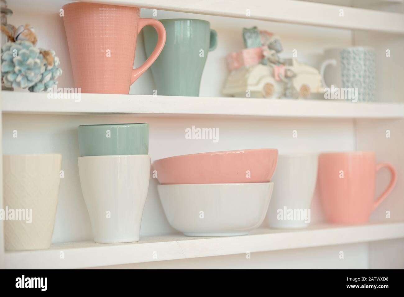 Kitchen shelves with dishes, plate and cup Stock Photo - Alamy