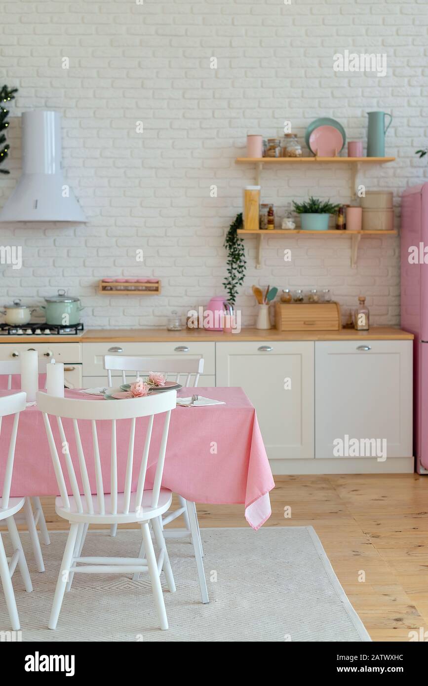 Light modern kitchen with white and rose colours Stock Photo - Alamy