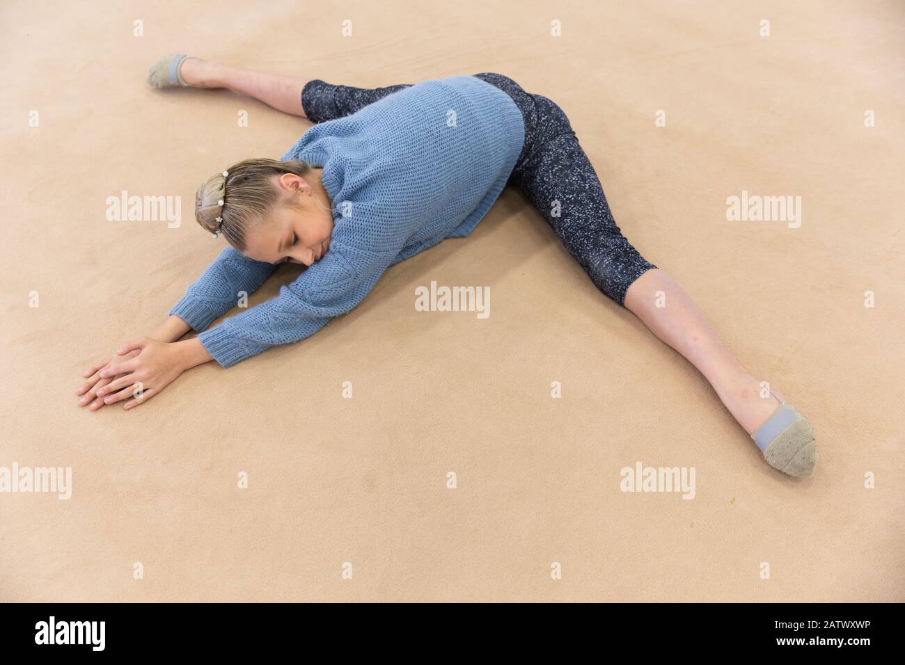 Gymnast stretching at the gym Stock Photo - Alamy