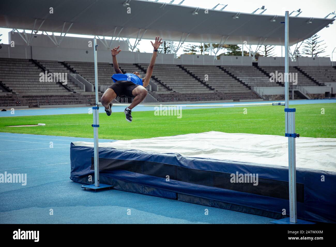Athlete doing a high jump Stock Photo - Alamy