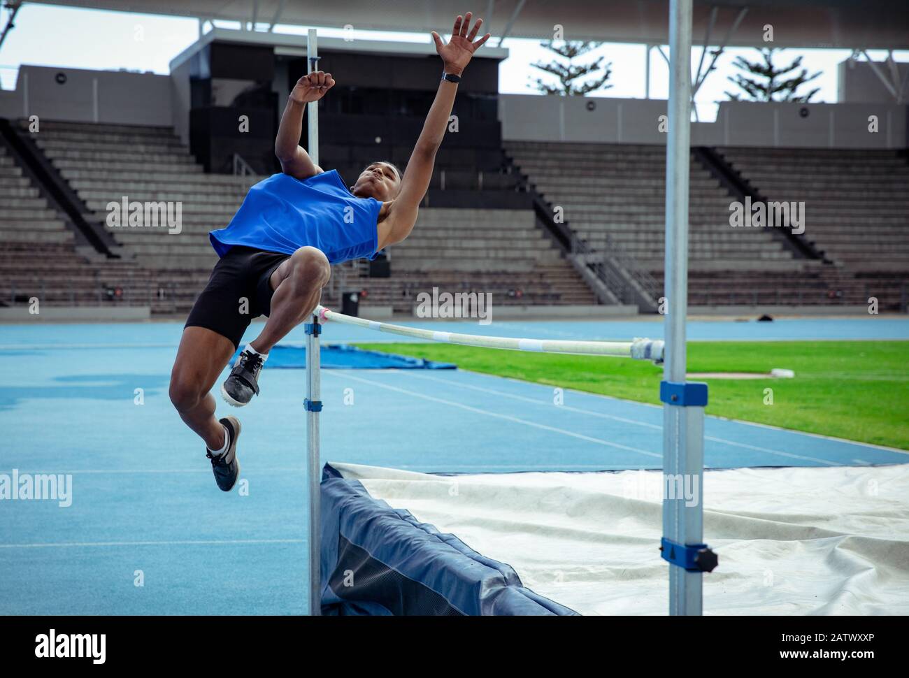 Athlete doing a high jump Stock Photo - Alamy
