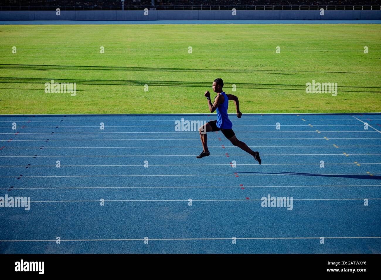 Athlete running at the stadium Stock Photo - Alamy