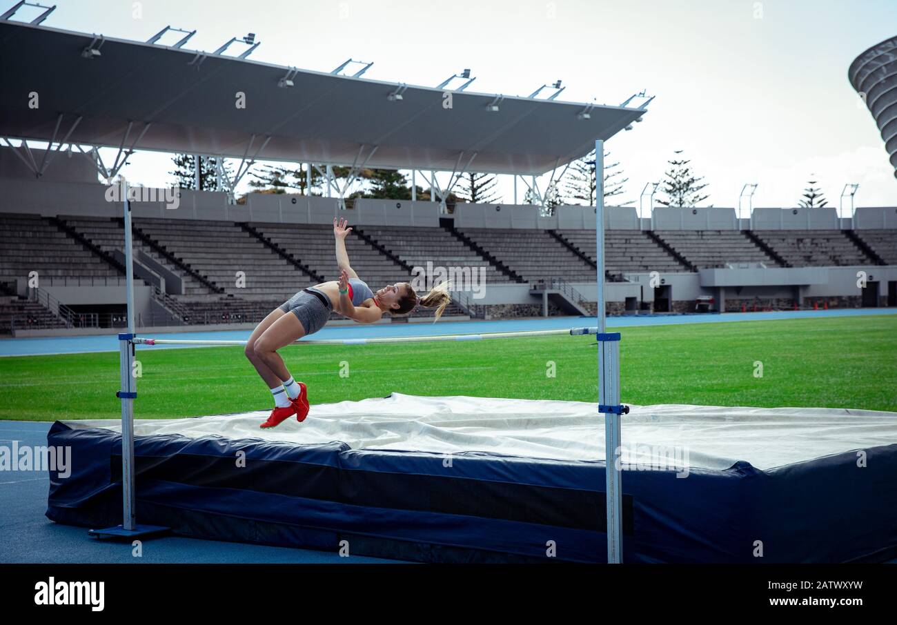Athlete doing a high jump Stock Photo - Alamy
