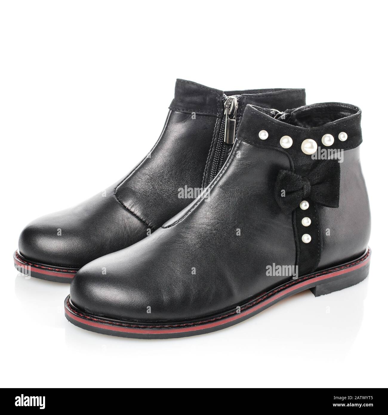 Black leather boots for girls with bow and pearls isolated on white ...