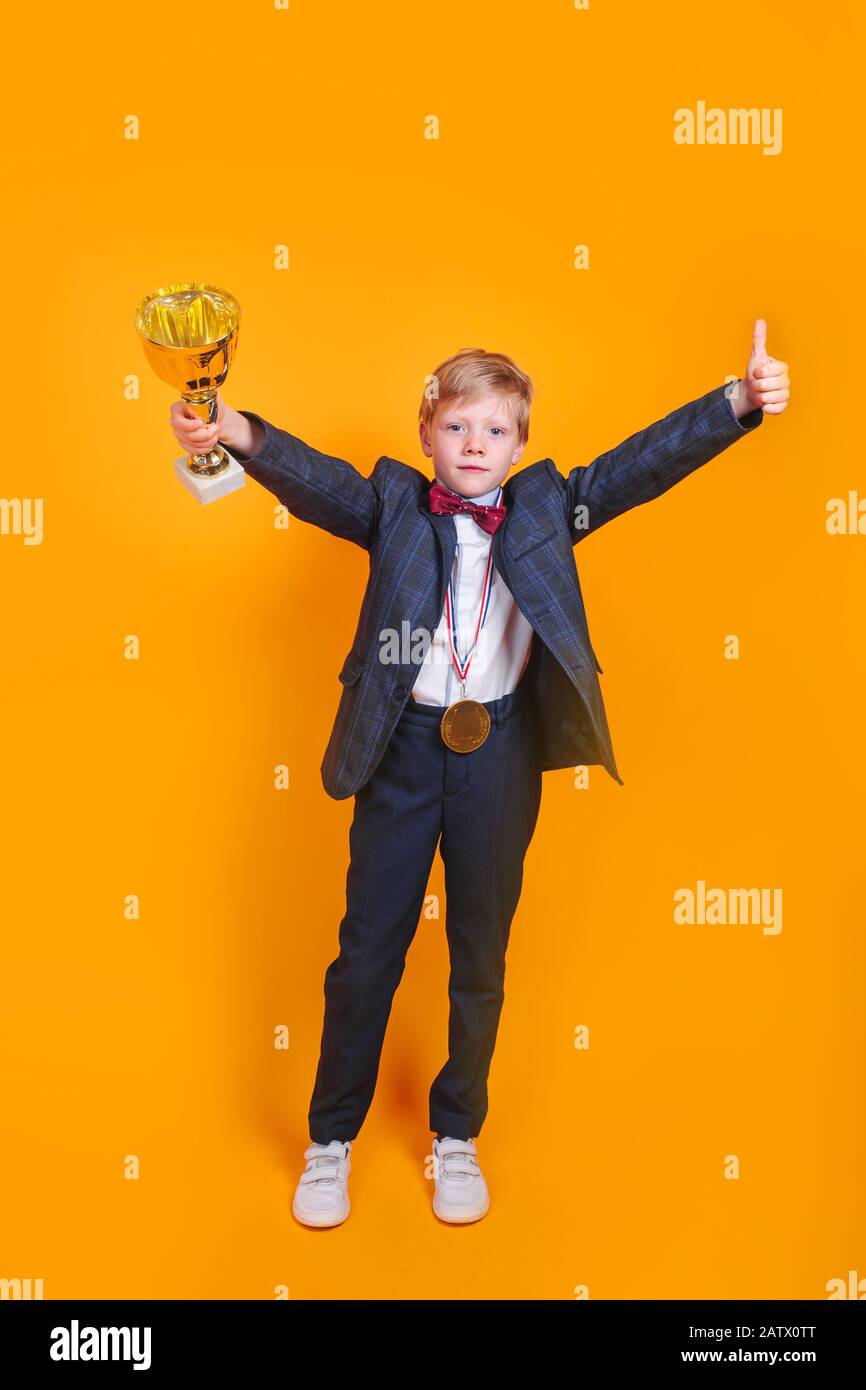 Boy trophy hi-res stock photography and images - Alamy