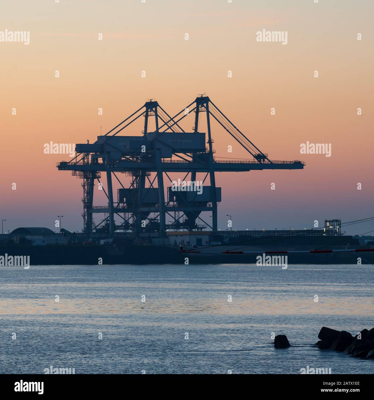 Sines container port terminal with cranes at sunset, in Portugal Stock ...