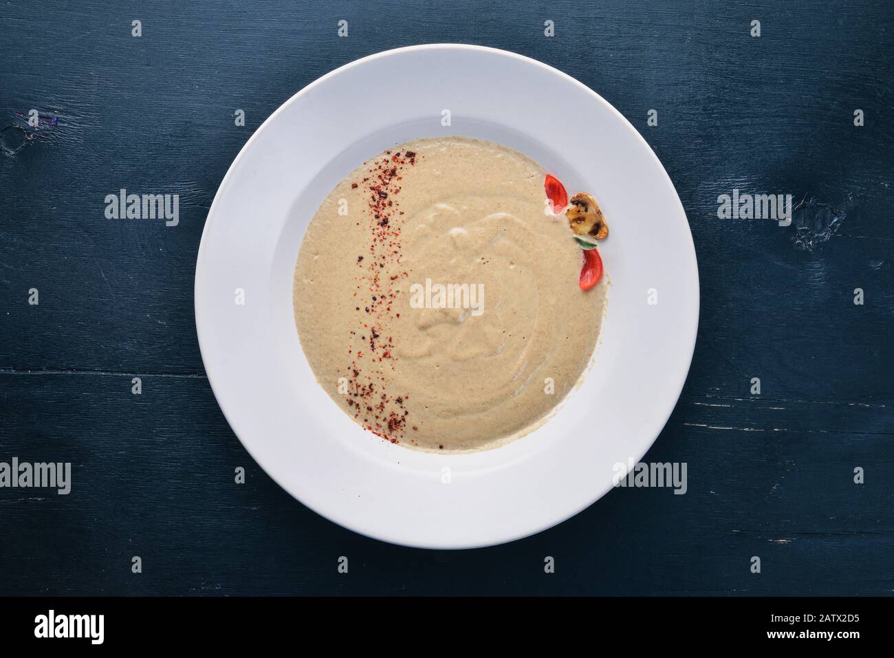 Mushroom puree soup. On a wooden background. Free space for your text ...