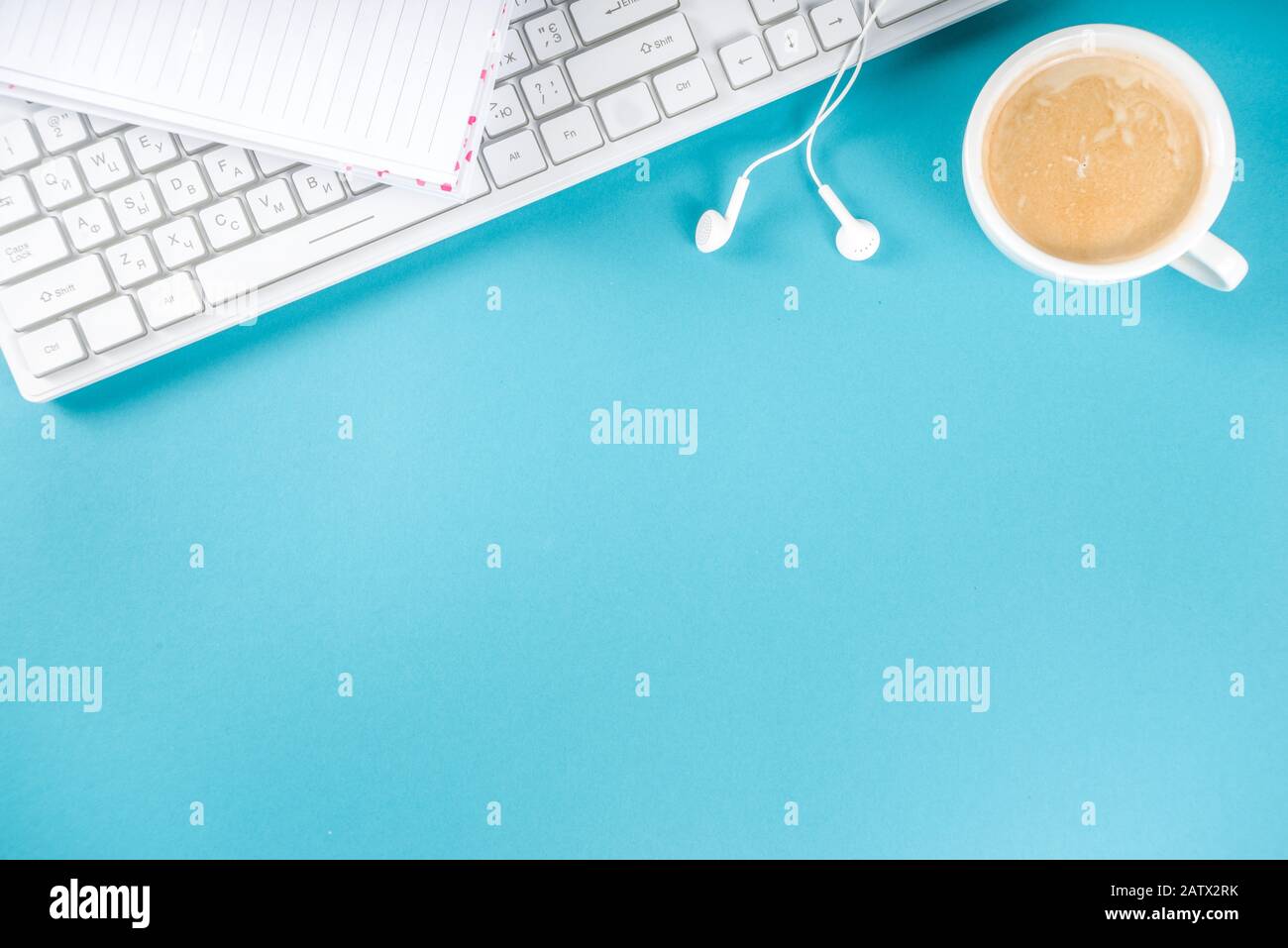 Office aquamarine, turquoise blue workplace backdrop with coffee cup ...