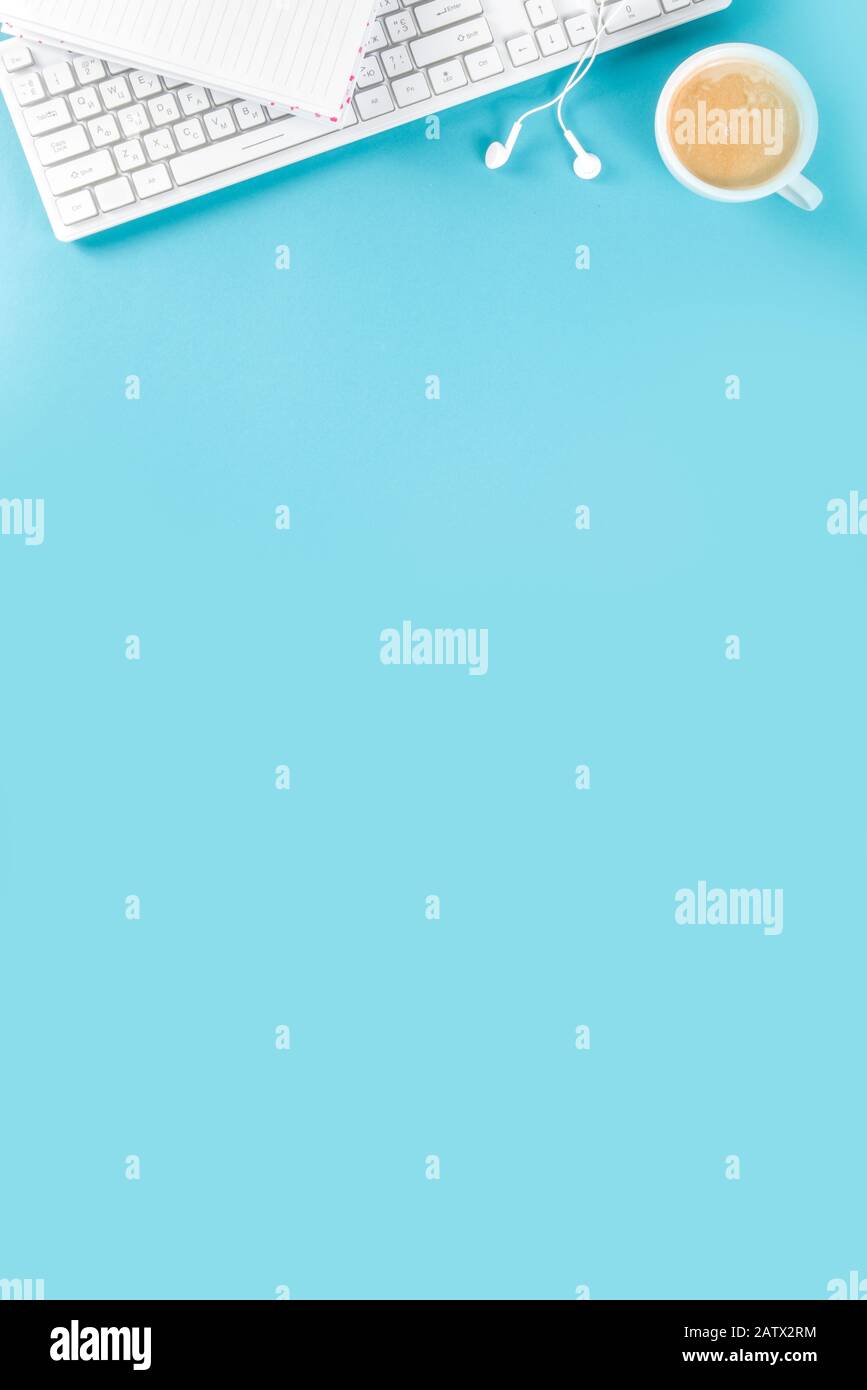 Office aquamarine, turquoise blue workplace backdrop with coffee cup ...