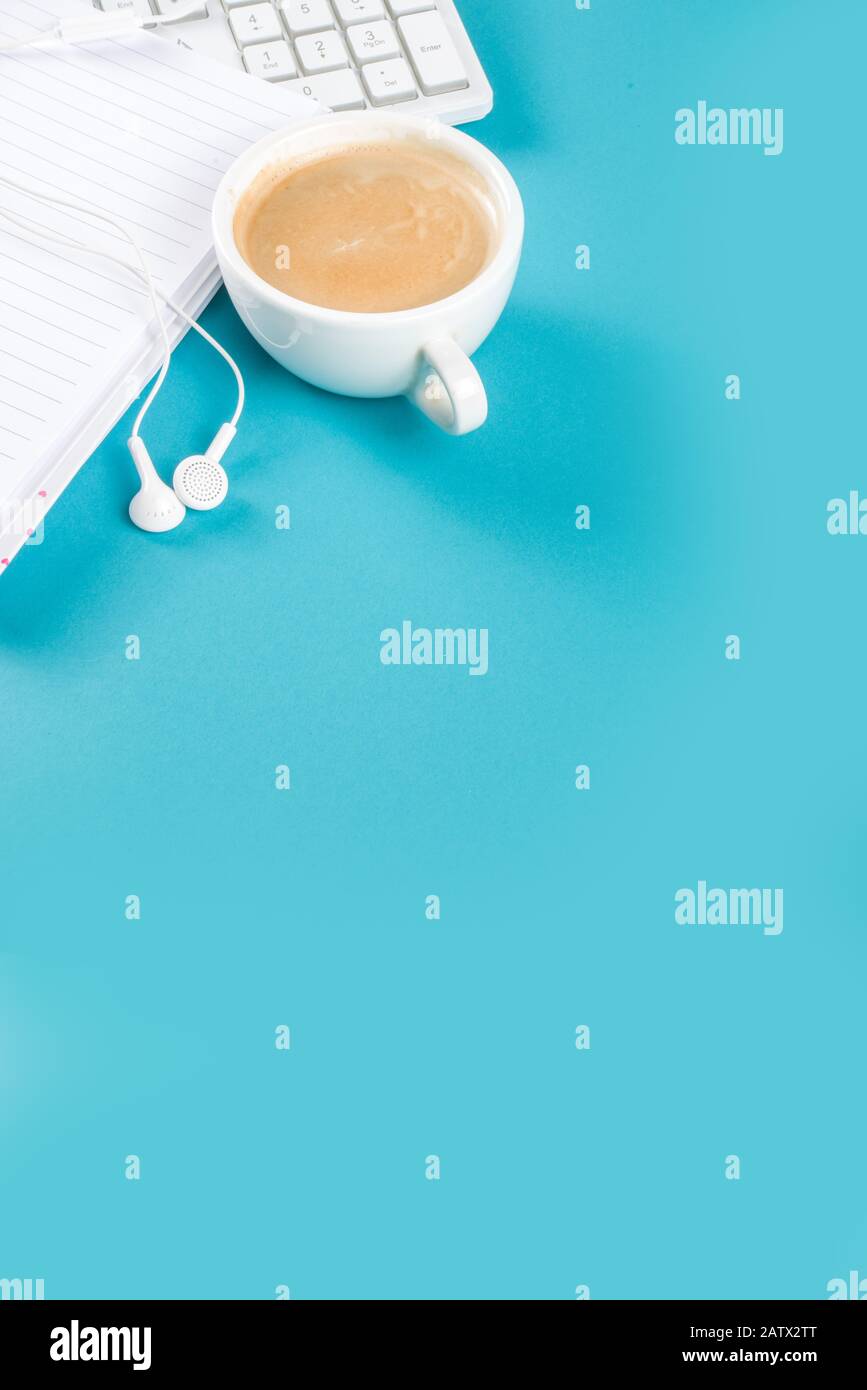 Office aquamarine, turquoise blue workplace backdrop with coffee cup ...