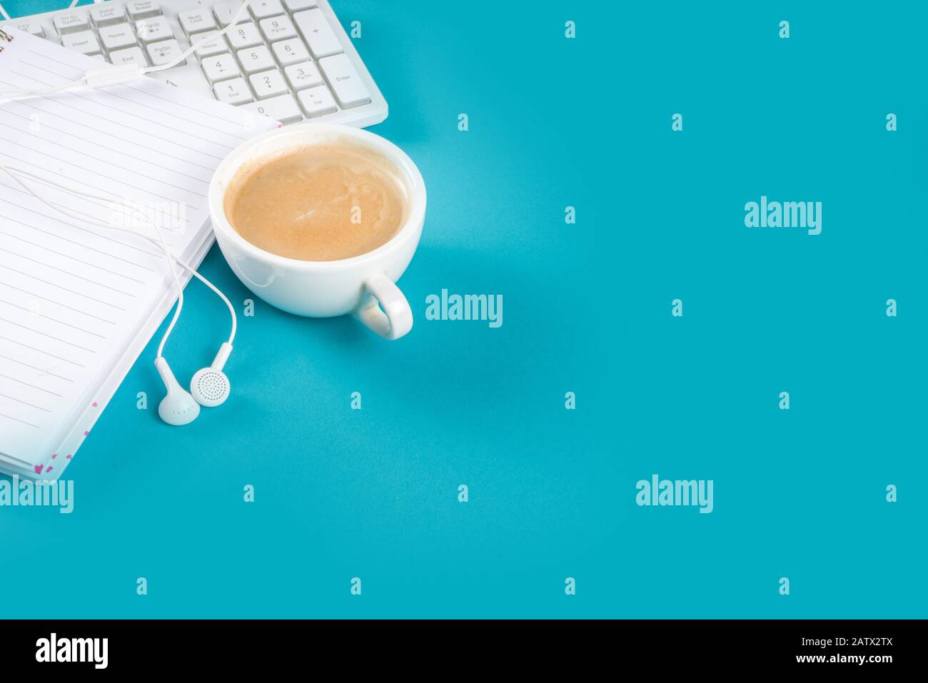 Office aquamarine, turquoise blue workplace backdrop with coffee cup ...