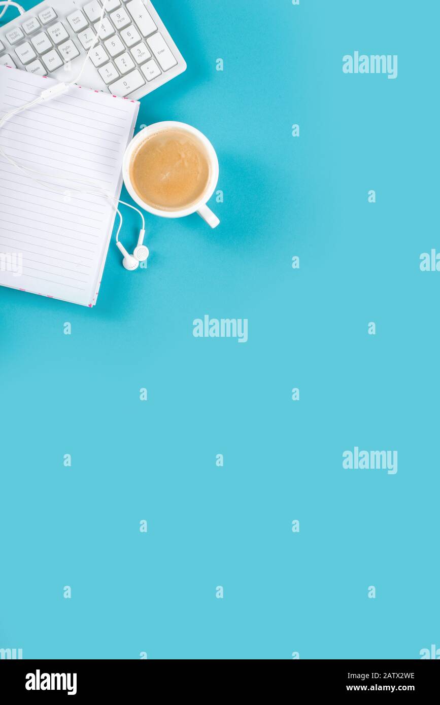 Office aquamarine, turquoise blue workplace backdrop with coffee cup ...