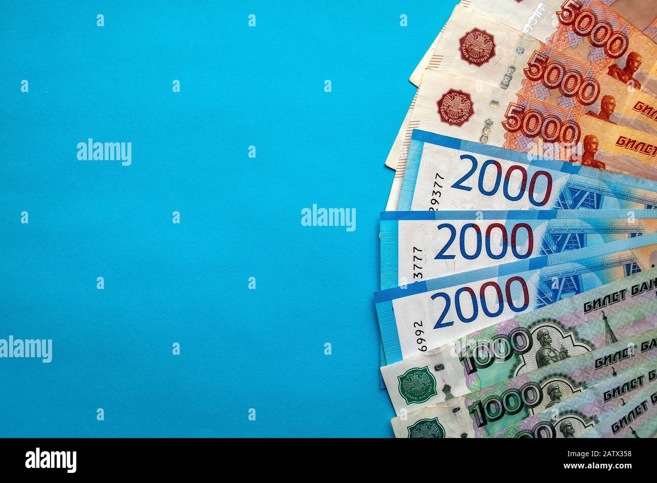 Russian national currency, rubles banknotes. Money banknotes on blue ...