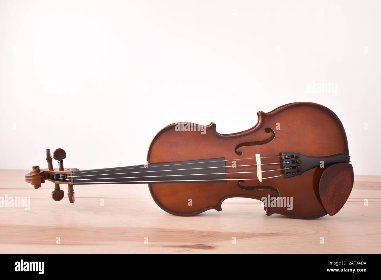 Violin on wooden table and white background. Horizontal composition ...