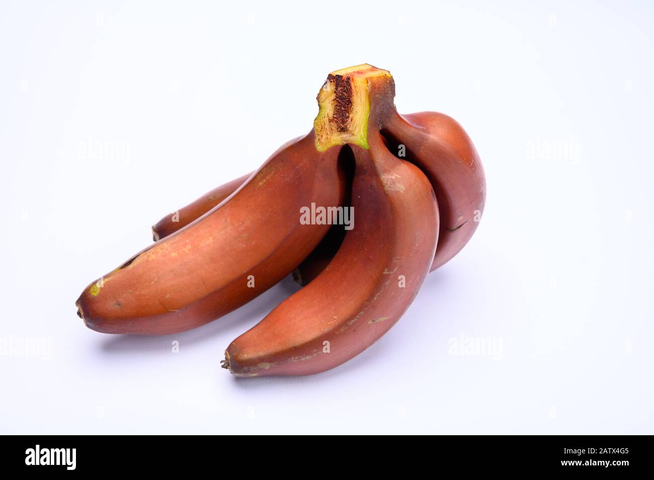 Bunch of ripe red bananas close up isolated Stock Photo - Alamy