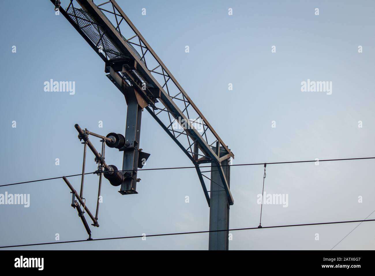 View of overhead electric lines used by train locomotives. Pole ...