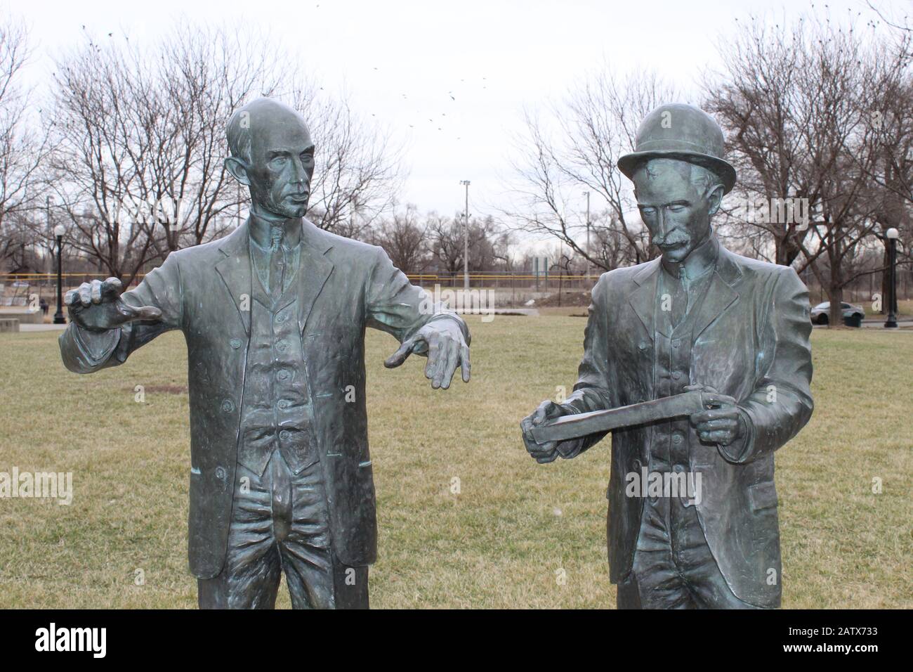 Wright Brothers Statue shows Wilbur explaining "wing warping" to ...