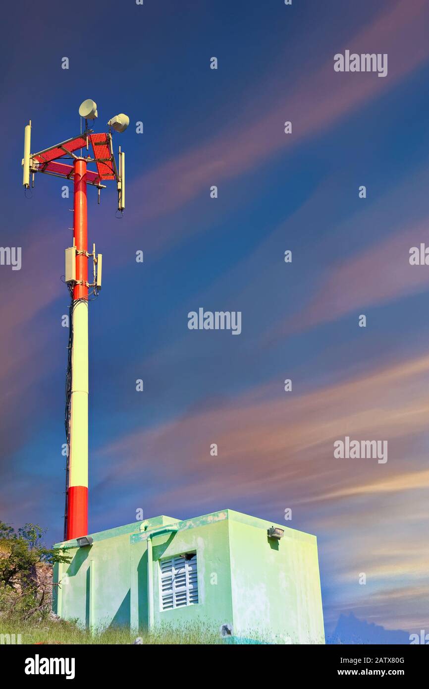 Cell Tower on Rocky Hill at Dusk Stock Photo - Alamy