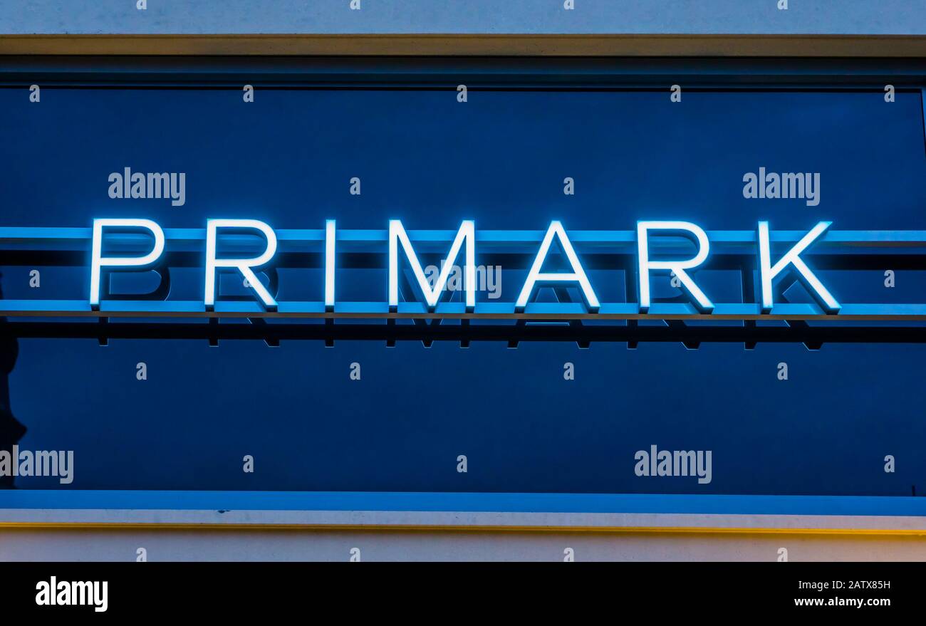 lighted primark neon sign on a shopping window, exterior of the primark ...