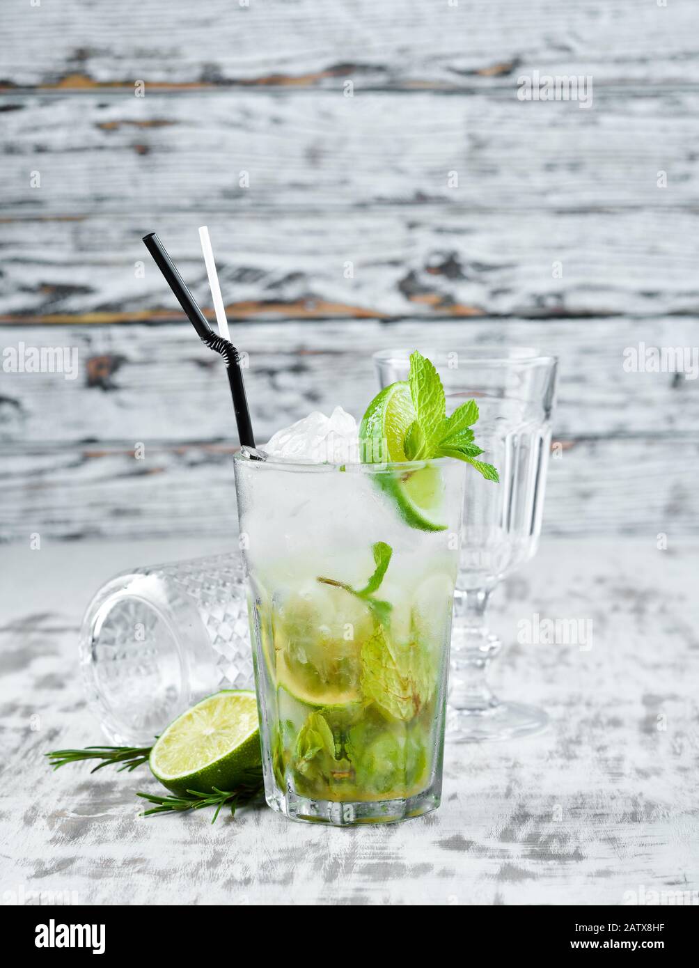 Alcohol Cocktail Mojito with menthol, lime and rum in a glass. On a ...
