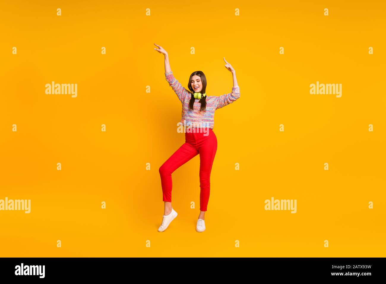 Full body photo of cheerful positive girl listen music song headset ...