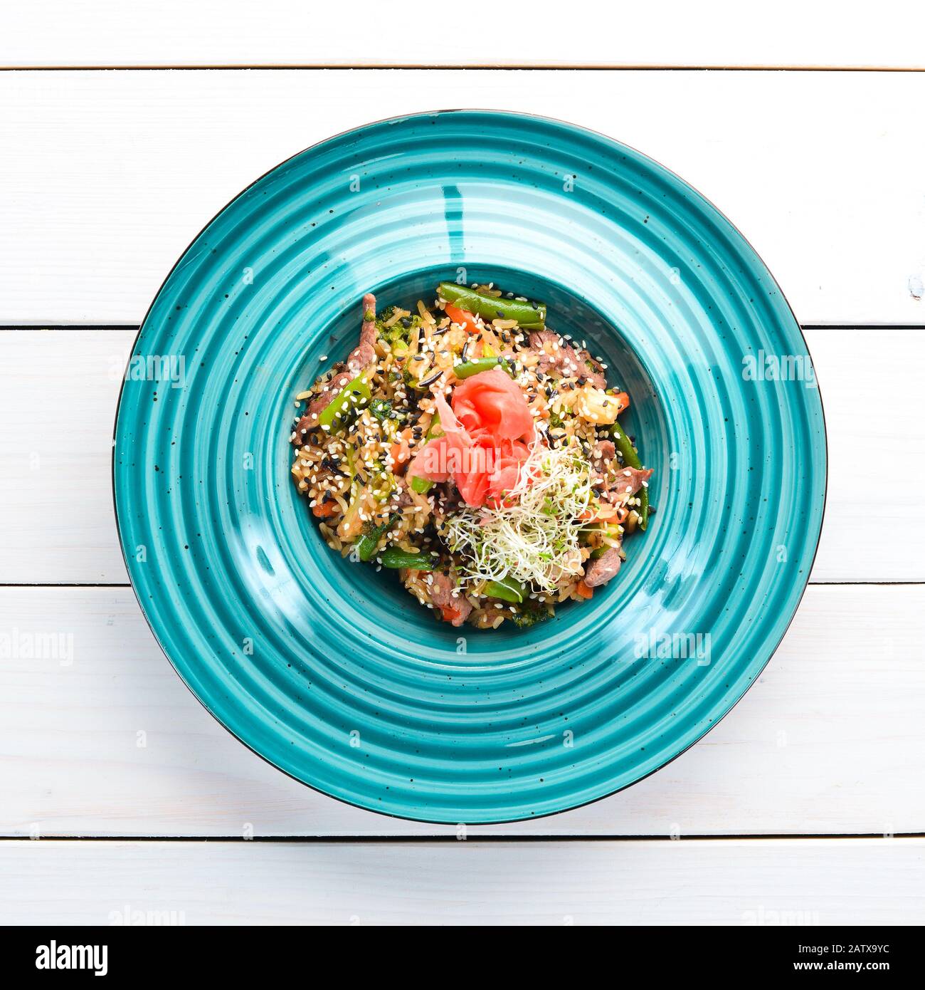 Risotto with veal and vegetables. Rice. In the plate. Top view. Free ...