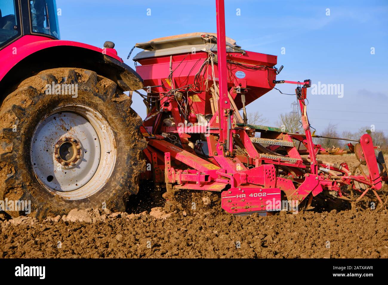 close up side view of a power harrow combination drill working in a ...