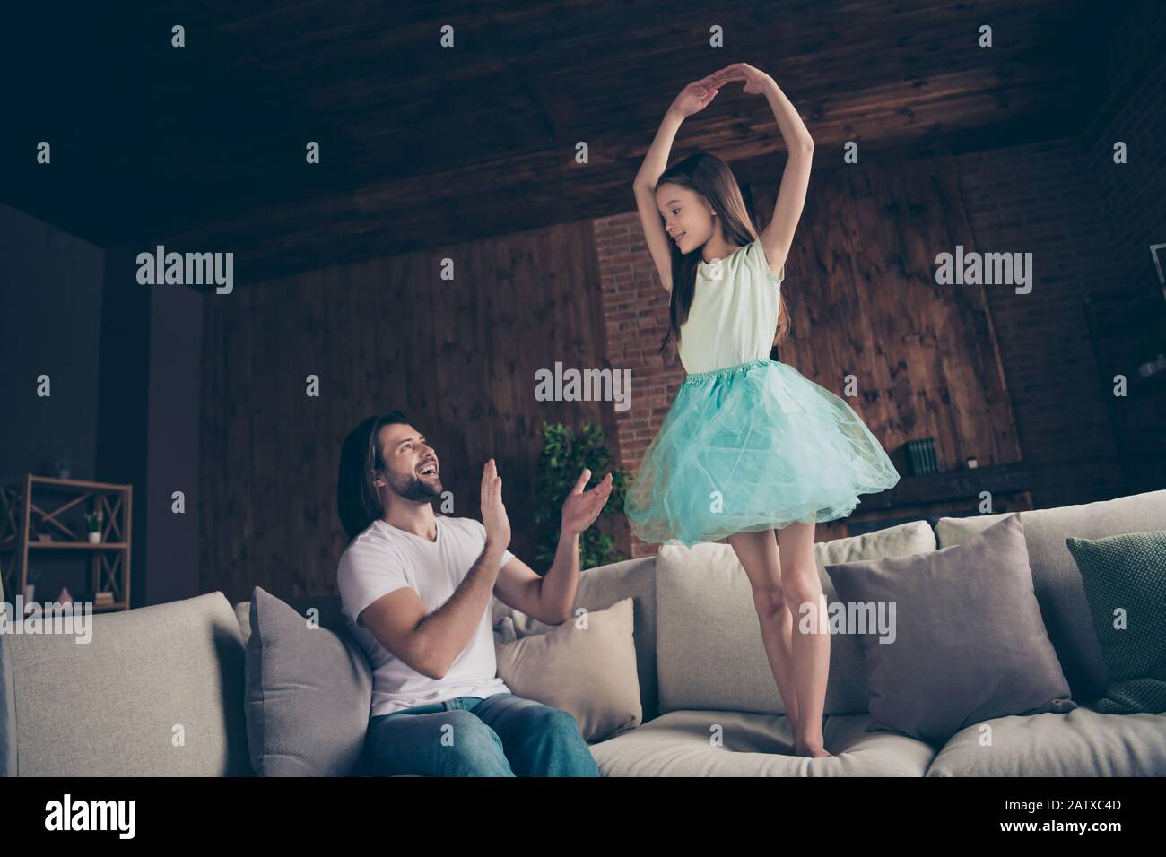 Photo of little energetic pretty lady excited handsome daddy watching ...