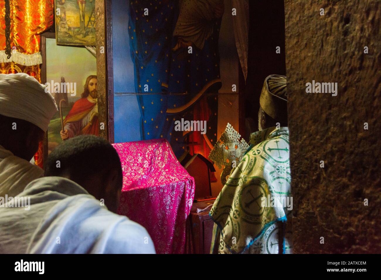 Lalibela, Ethiopia - Nov 2018: Mass ceremony and priest holding a cross ...