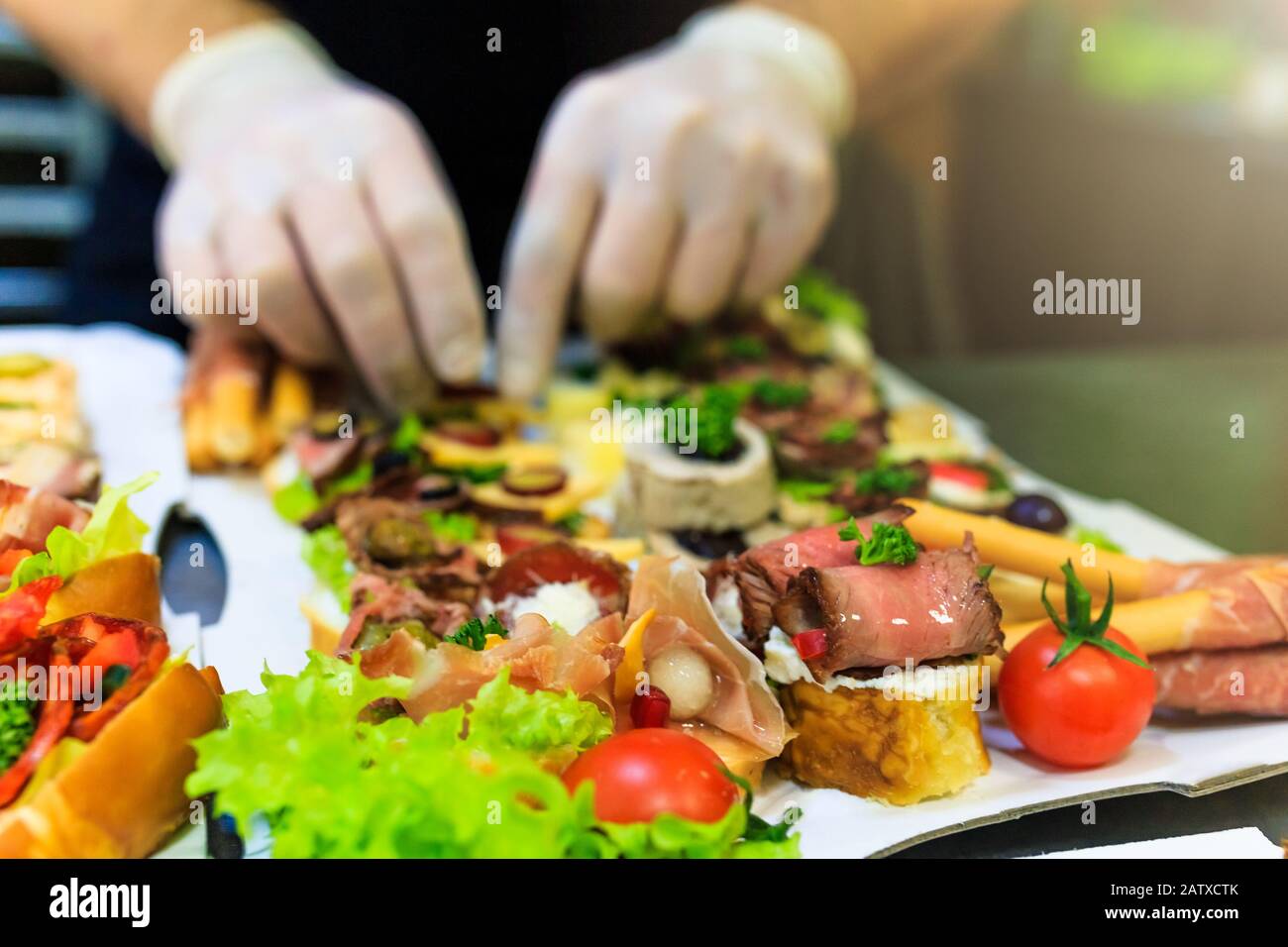 Buffet meal preparation and serving at restaurant Stock Photo - Alamy