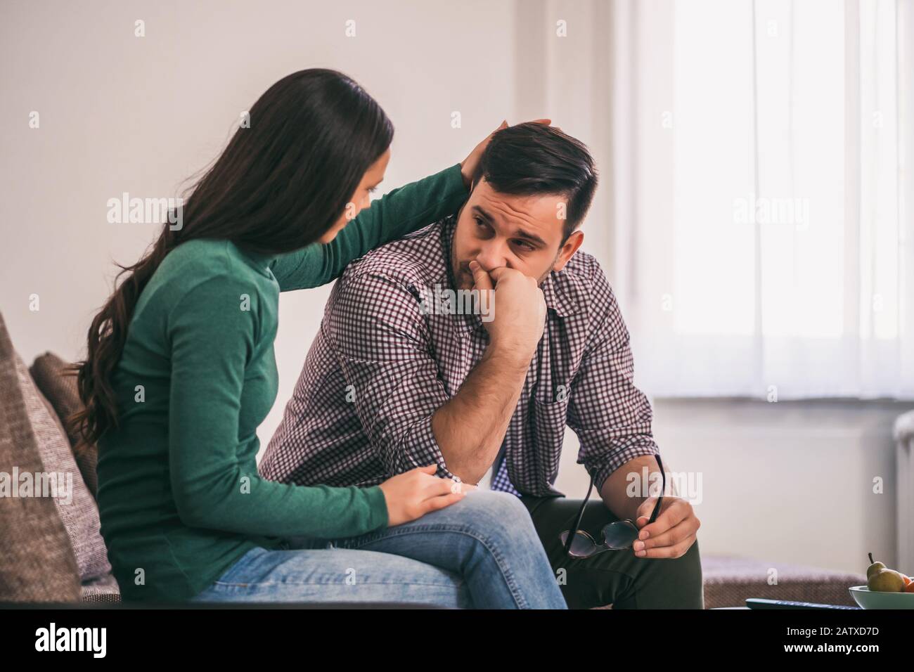 Husband consoling sad wife hi-res stock photography and images - Alamy