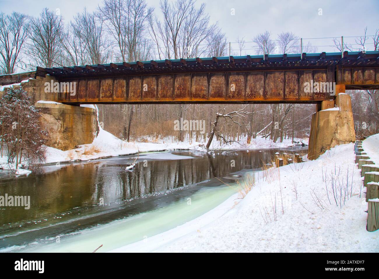A rusty train tressel spans Michigan's Huron River in this beautiful ...