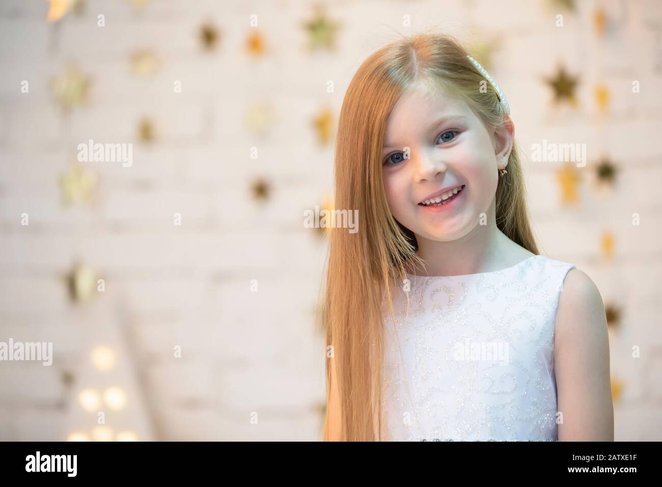 Portrait of a beautiful baby girl. The face of a five year old child ...