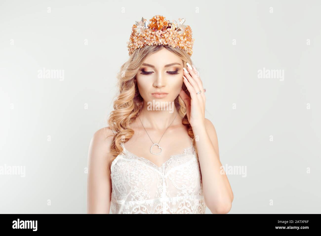 Beauty crowned queen girl woman actress miss looking down eyes closed ...