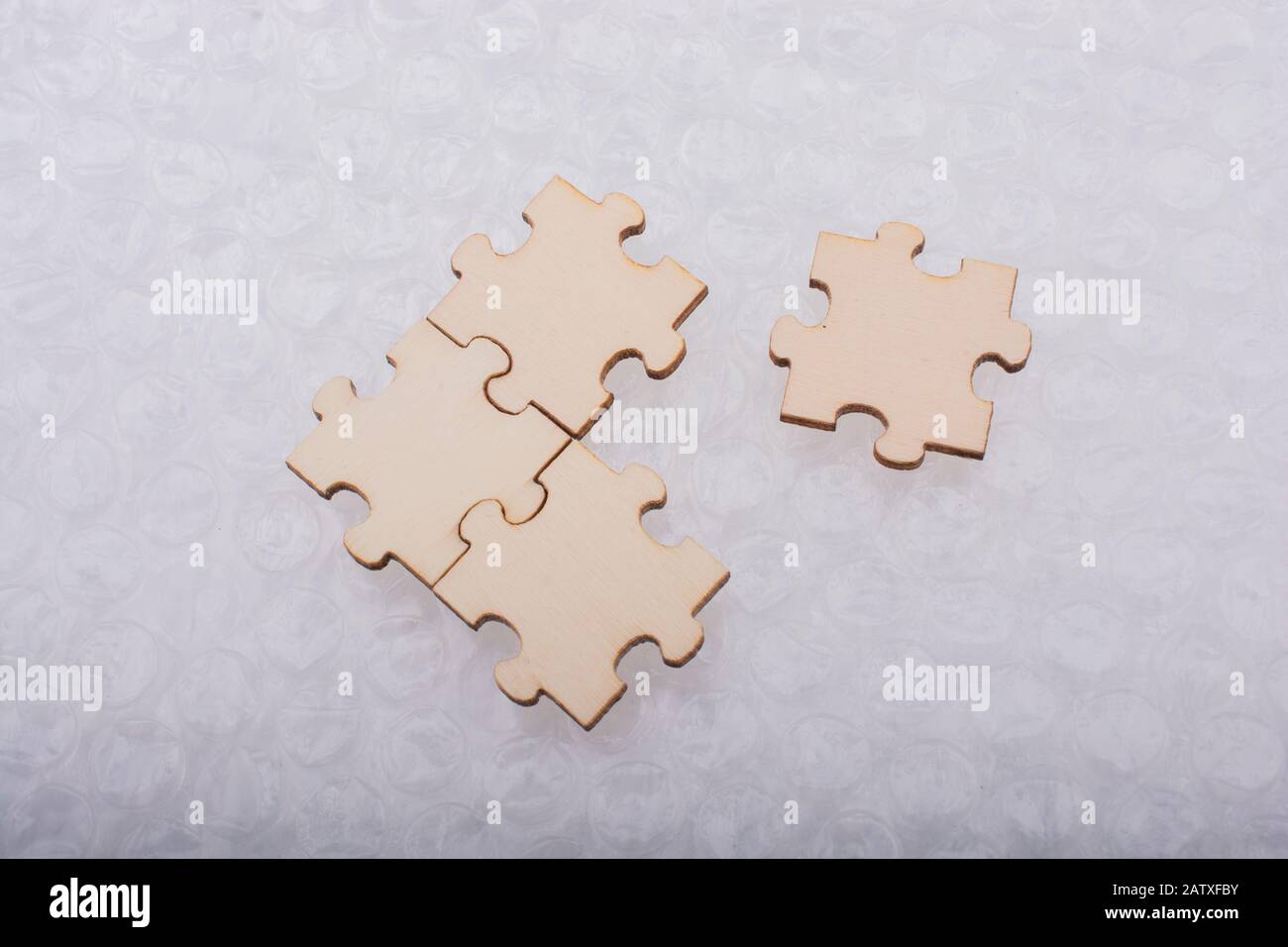 Pieces of jigsaw puzzle as problem solution concept on white background ...