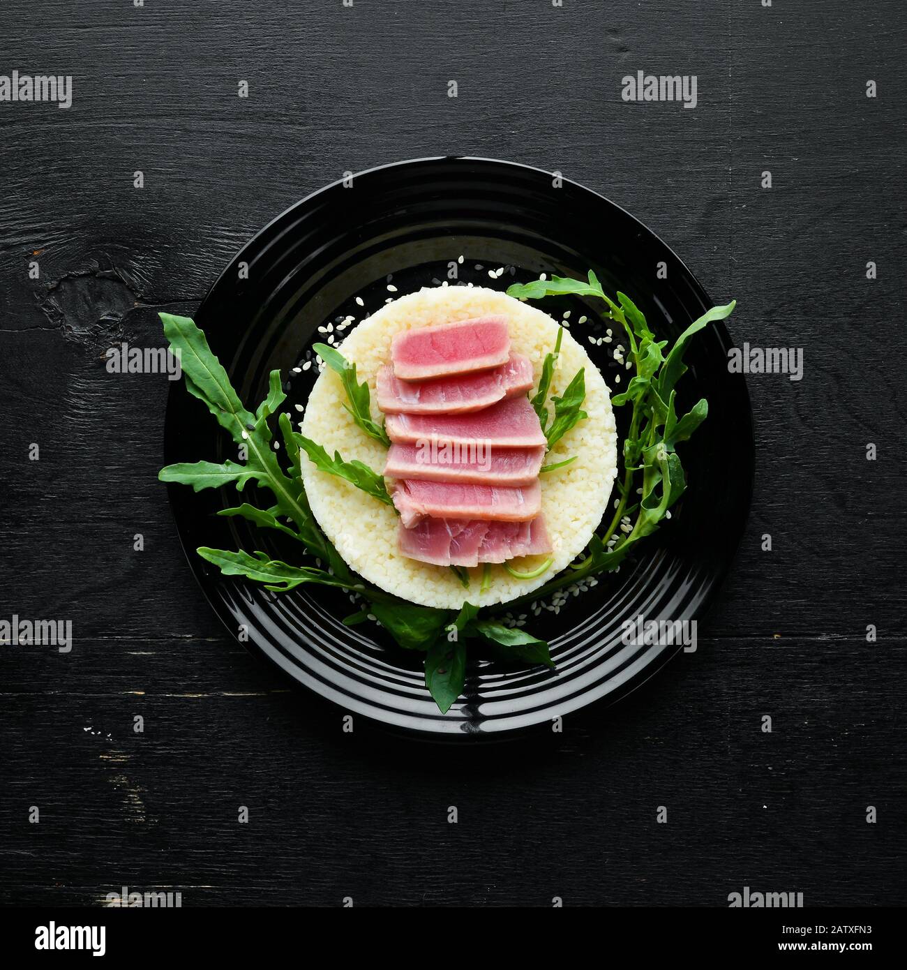 Tuna fillet and couscous. Dishes menu. Free copy space. Top view Stock ...