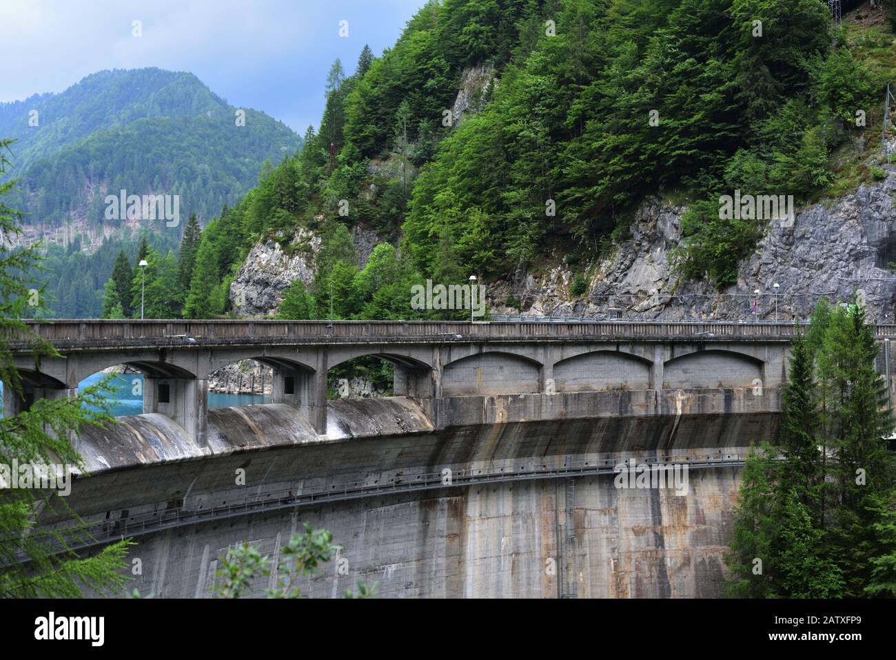 The ancient concrete dam forms the artificial basin of Lake Sauris ...