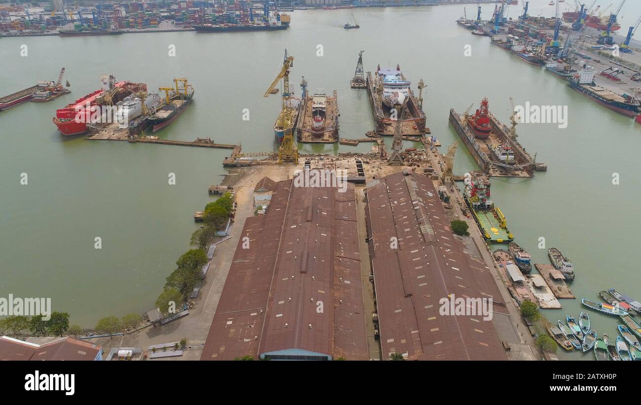 aerial view cargo and passenger seaport with ships and crane Tanjung ...