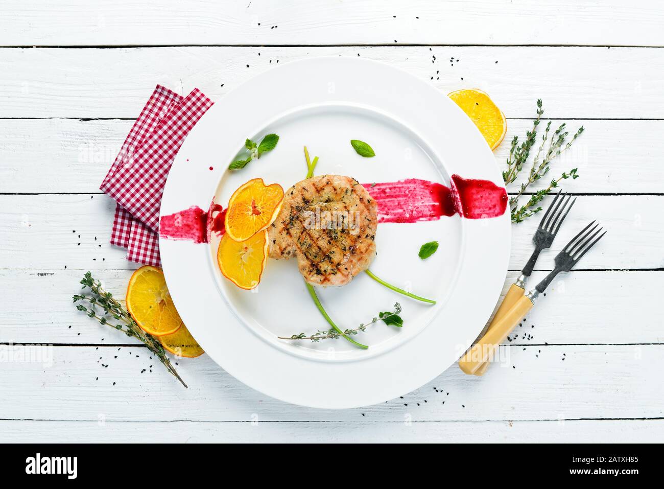 Grilled pork steak on a plate. Dishes, food. Top view. Free space for ...