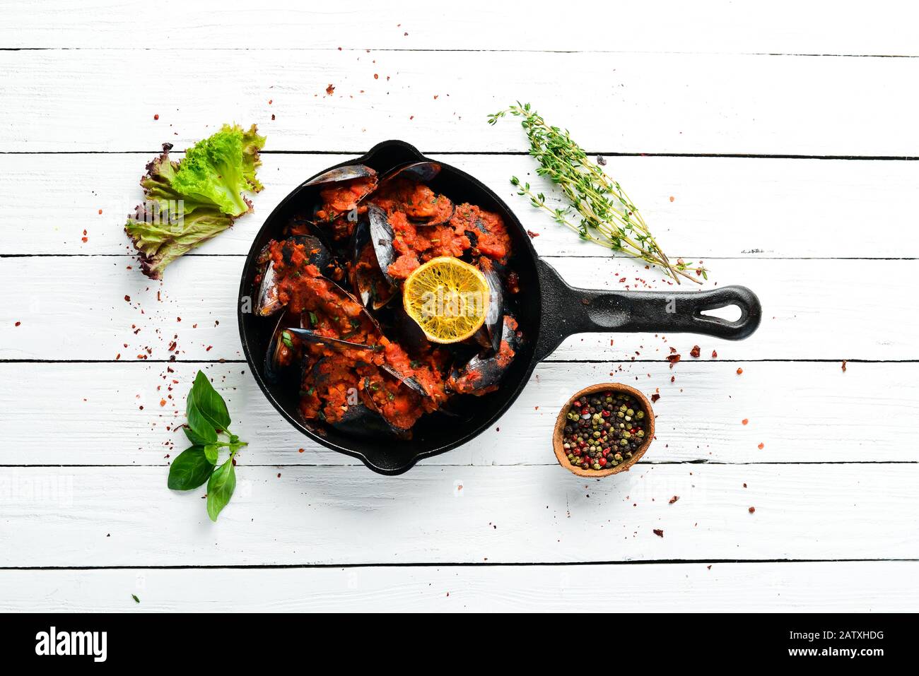 Mussels cooked in tomato sauce. Seafood. Top view. Free space for your ...