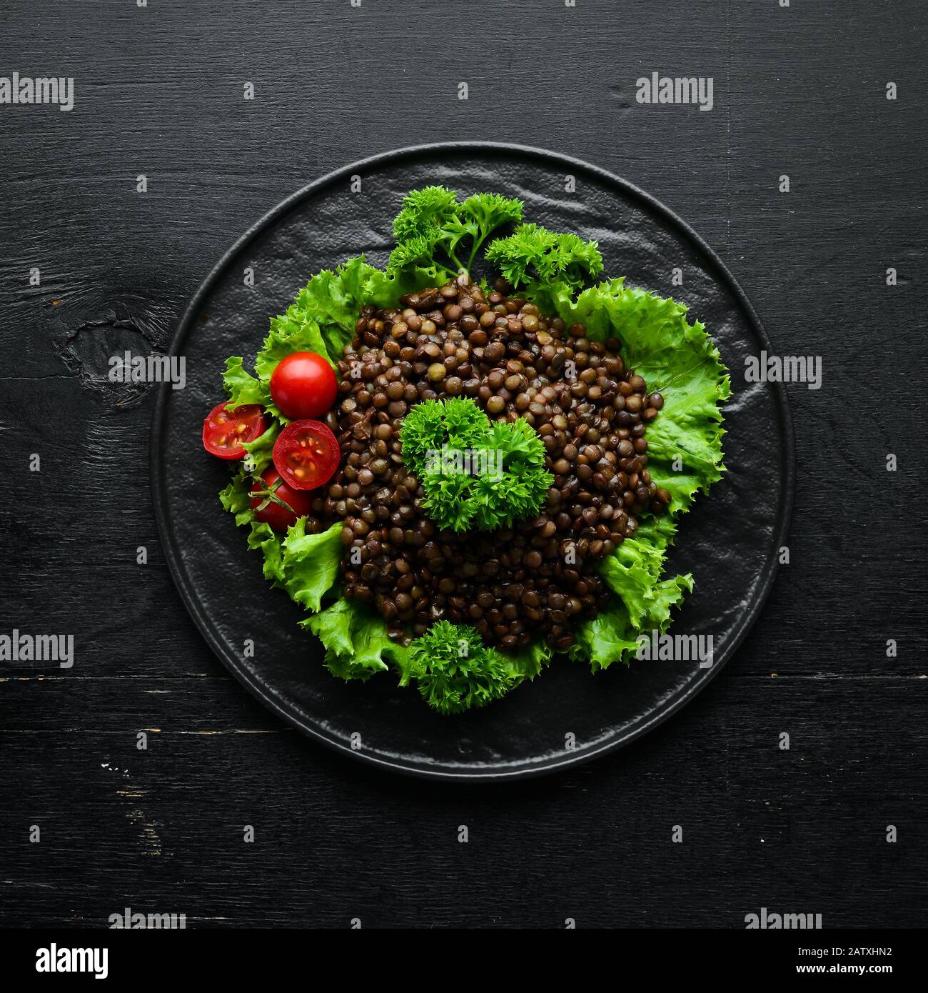 Boiled lentils with vegetables. Dishes menu. Free copy space. Top view ...