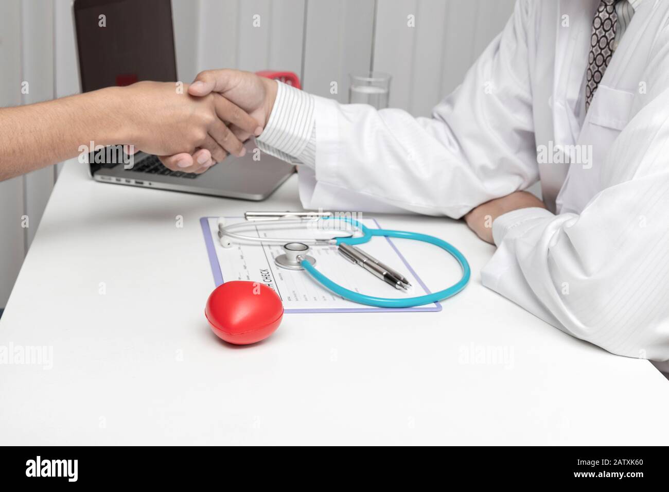 Asian patient doctor handshake hi-res stock photography and images - Alamy