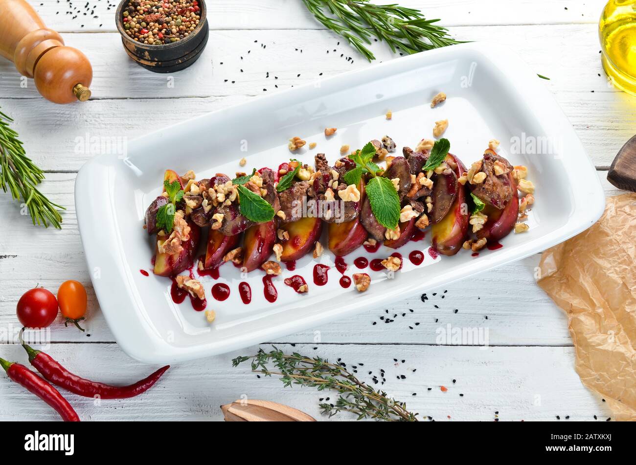 Baked goose liver with apple and cranberry sauce. Top view. Free copy ...