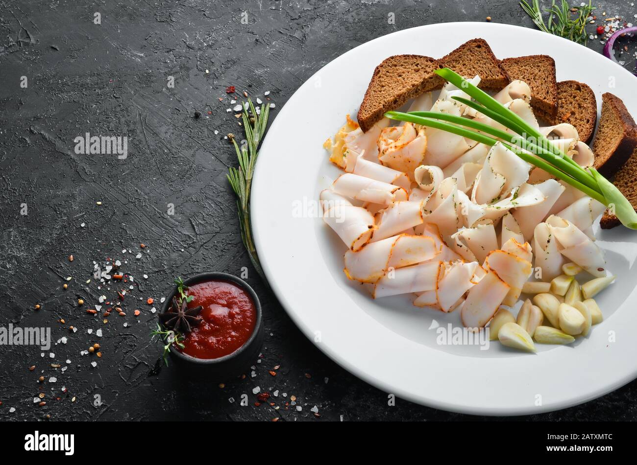 Sliced lard on a plate with black bread and onions. Top view. Free ...