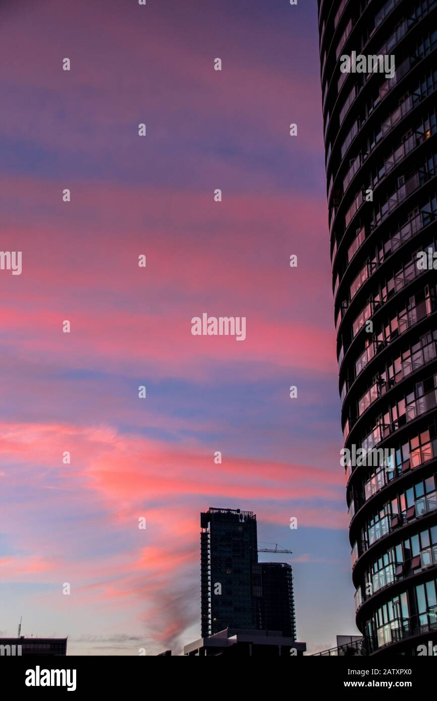 City buildings with pink sunset Stock Photo - Alamy