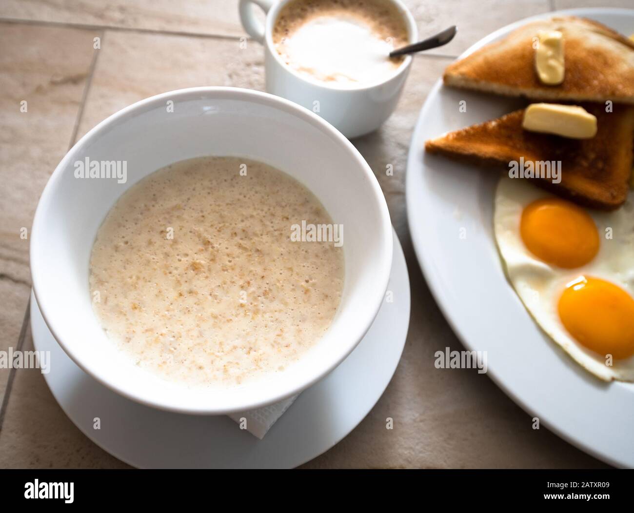 Oatmeal and Scrambled Eggs with Breakfast Toast Stock Photo - Alamy