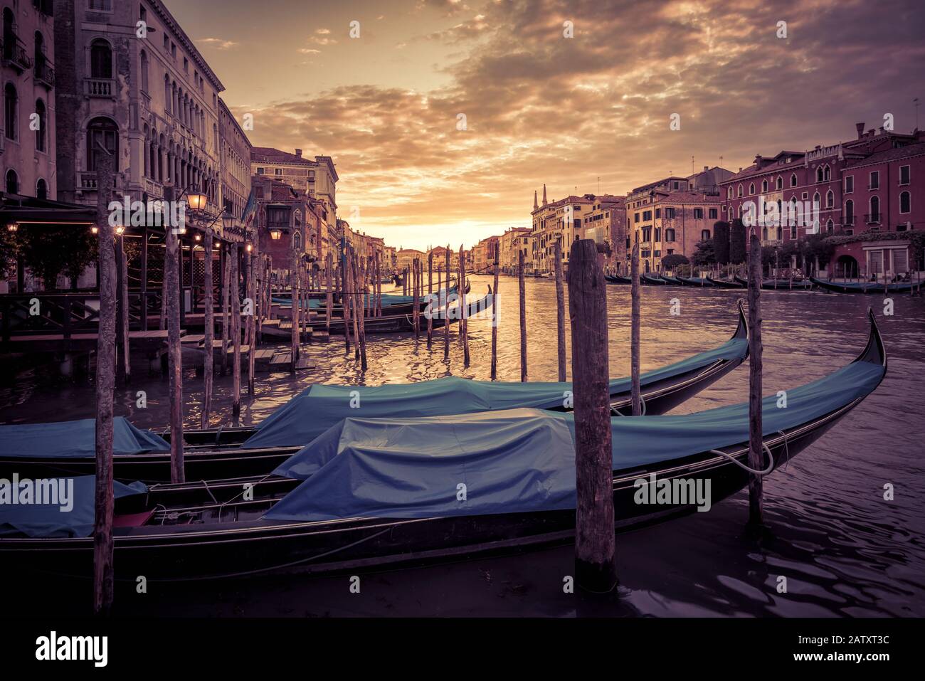 Grand Canal with gondolas at sunset in Venice, Italy. Grand Canal is ...