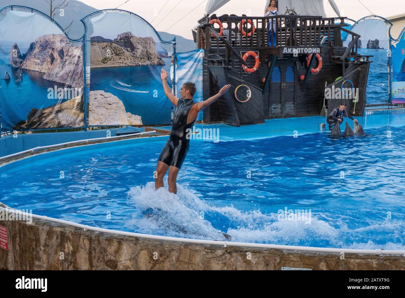 Man riding dolphin hi-res stock photography and images - Alamy