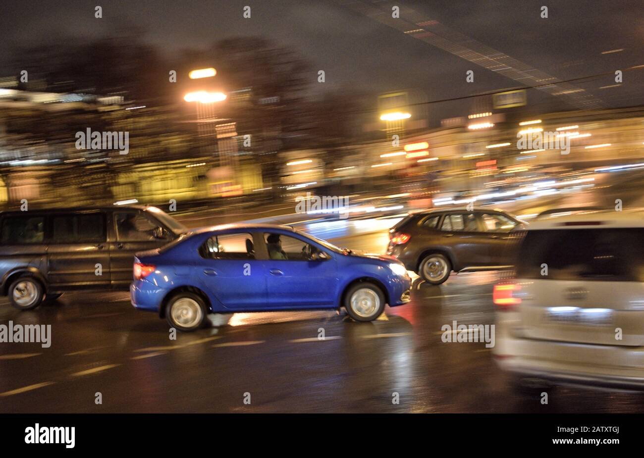 High-speed car driving.On the streets of the city glow electric lights ...