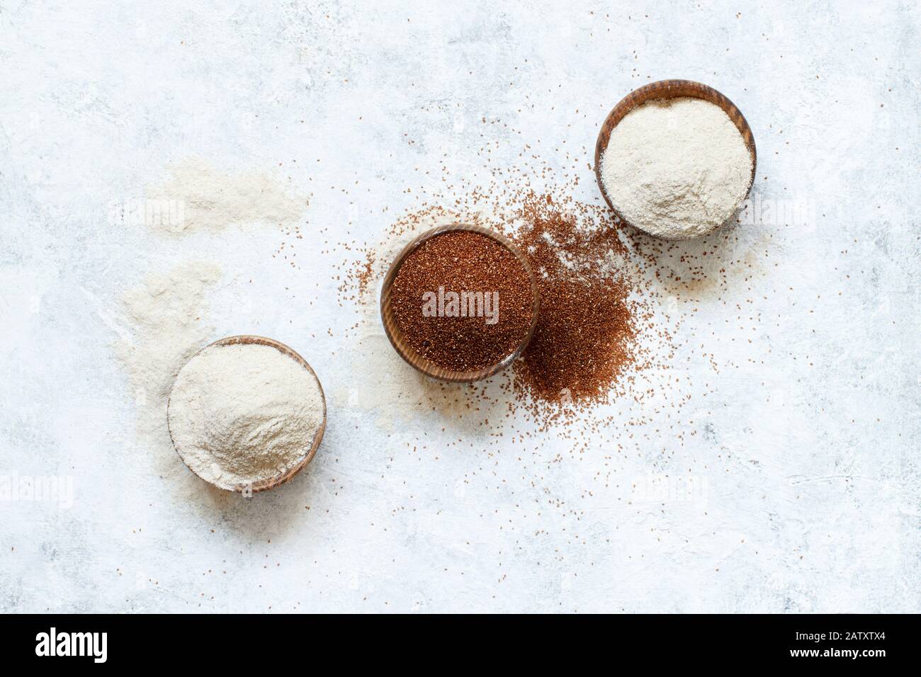 Raw teff grain and teff flour in a wooden bowls top view Stock Photo ...
